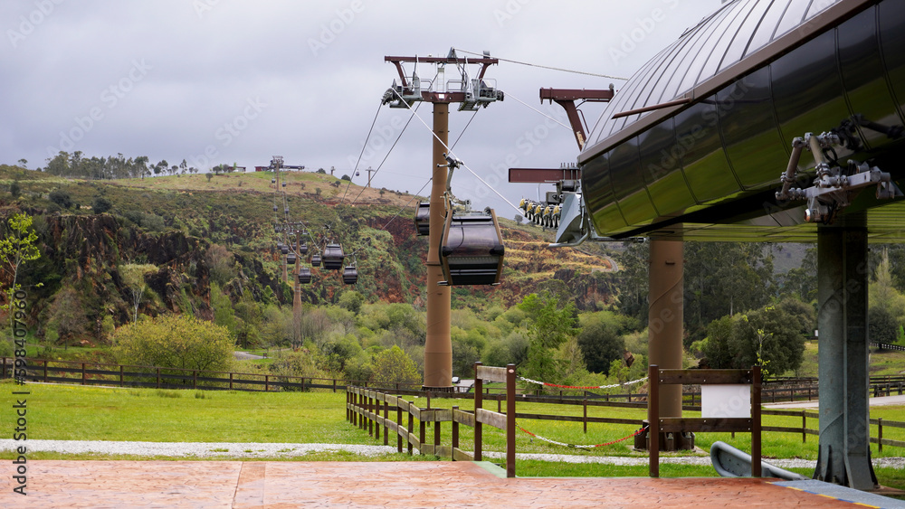 Cable car above the animal park, photo of the entry point of the green ...