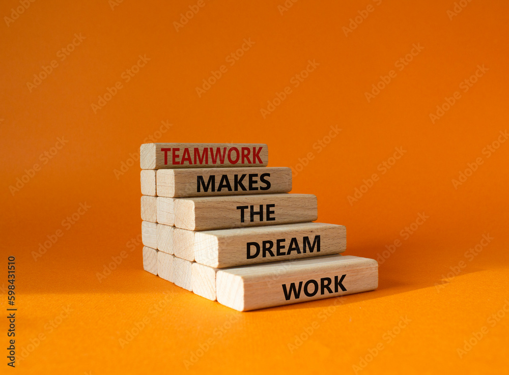 Teamwork symbol. Wooden blocks with words Teamwork makes the Dream work ...