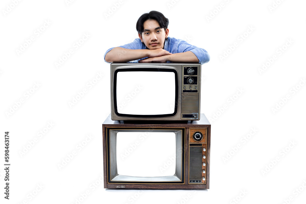 Handsome young man looking at the camera with two old tvs isolated on ...