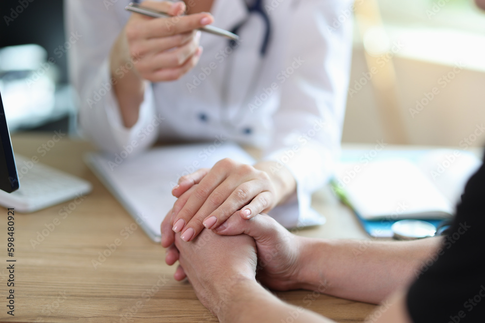 Doctor supports patient after revealing severe diagnosis Stock Photo ...