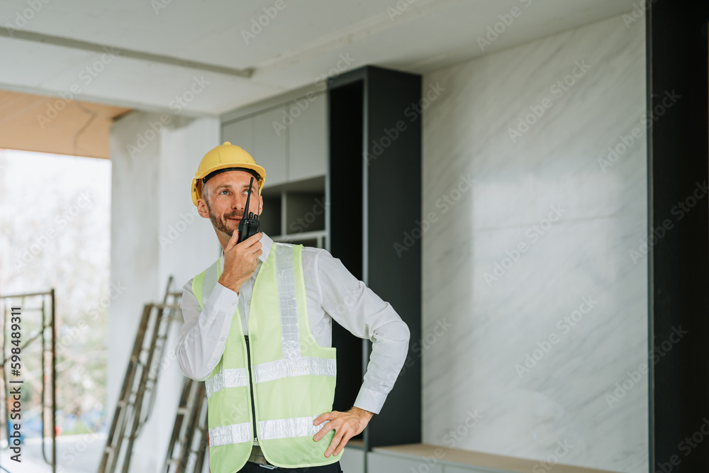 multi ethnic engineer brainstorming and measuring for cost estimating ...