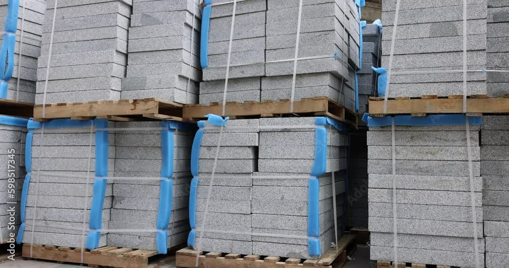 Granite slabs on pallets in warehouse. Building materials for finishing ...