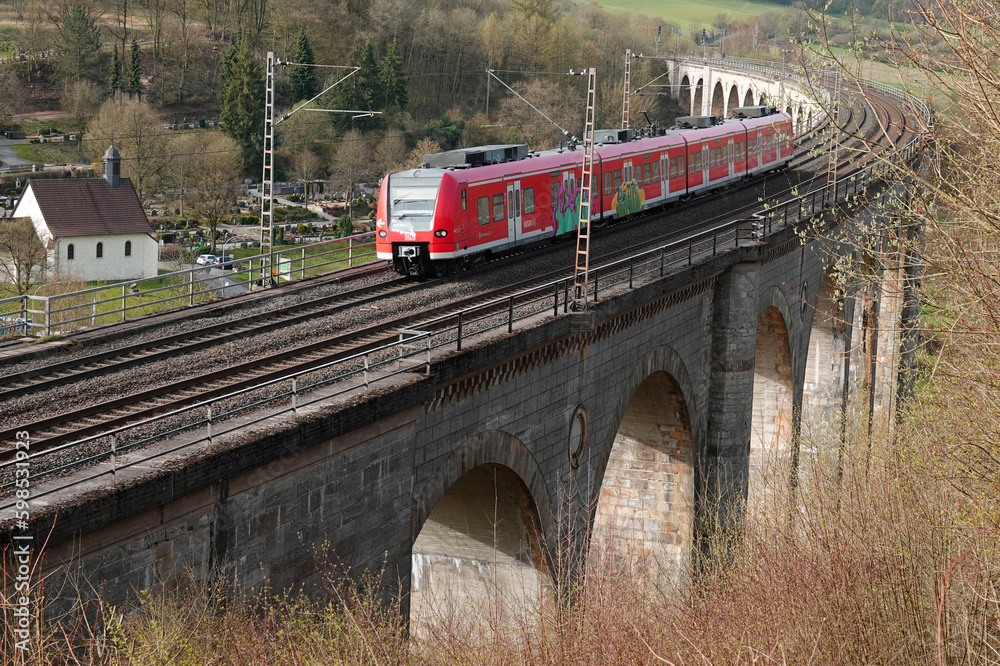 Altenbeken, Germany - Apr 13 2020 - A red train from the German ...