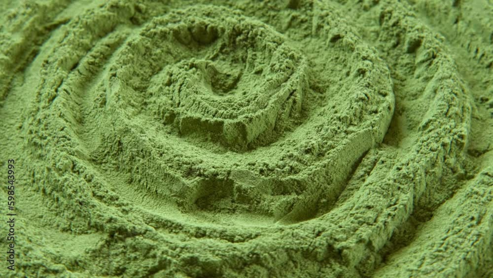 Chlorella or spirulina algae green powder is spinning, rotation ...
