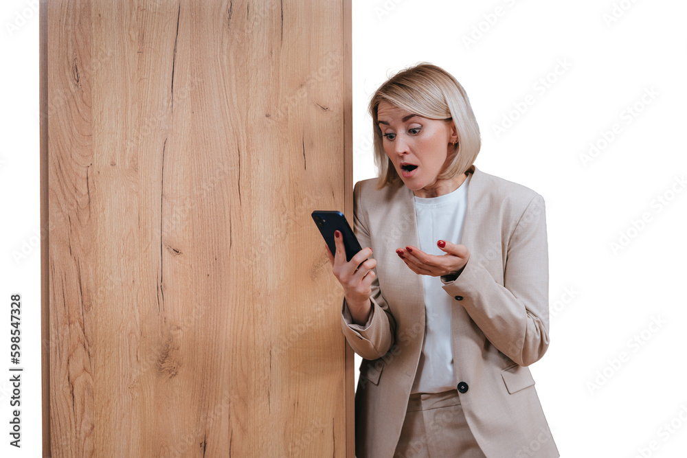 Shocked young German businesswoman in beige suit at office leans on ...