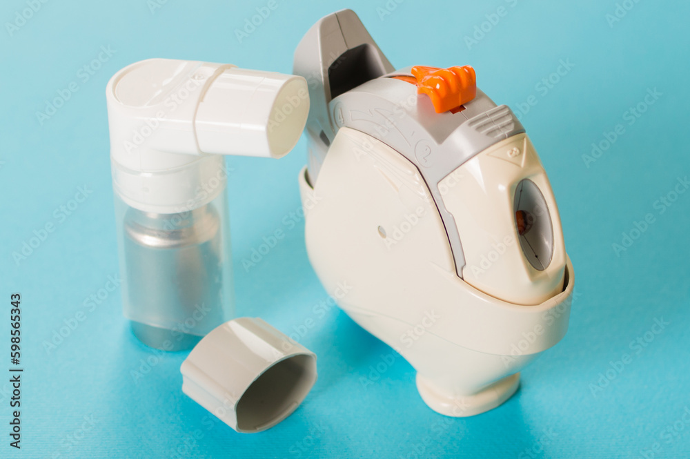 Inhalers to prevent asthma attack symptoms on the blue background ...