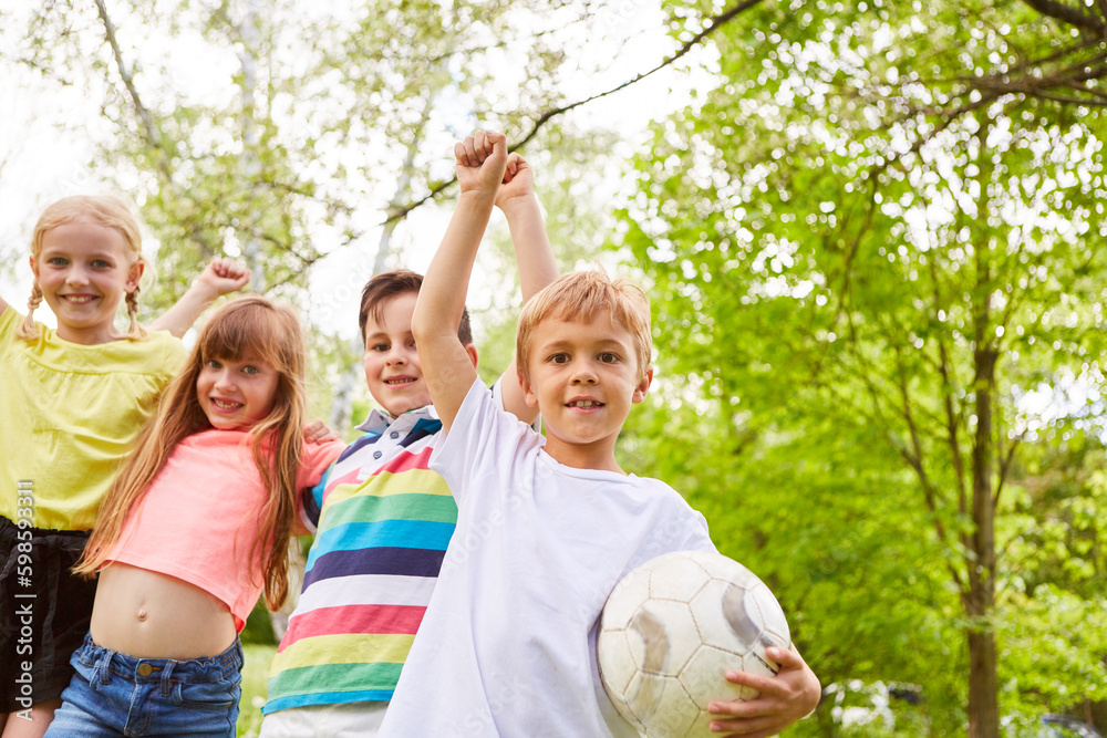 Multiracial boys and girls cheering after winning game Stock Photo ...