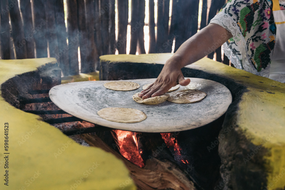 Authentic Mexican handmade tortillas in a traditional rustic wood stove ...