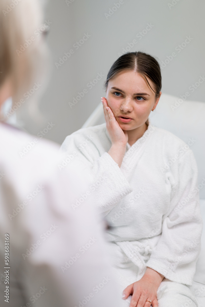 A Young Girl Patient Complains To The Doctor About The State Of Health