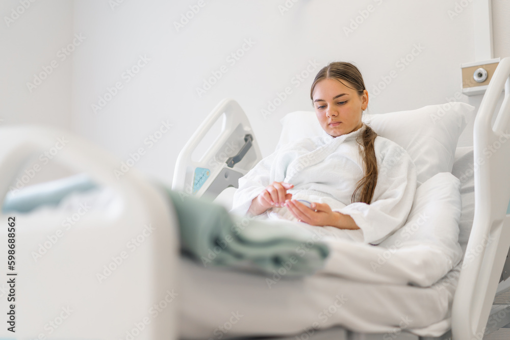 young sick girl patient presses emergency call button and calls nurse ...