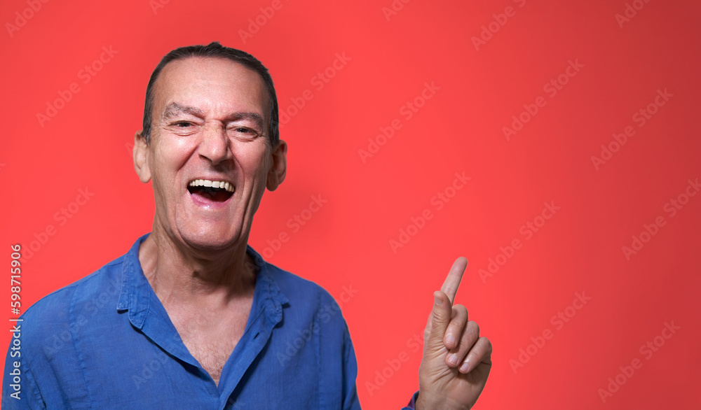 Funny and smiling mischievous mature adult caucasian male with blue ...