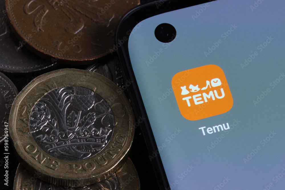 TEMU app seen on the screen of smartphone and pound coins. Temu app and ...