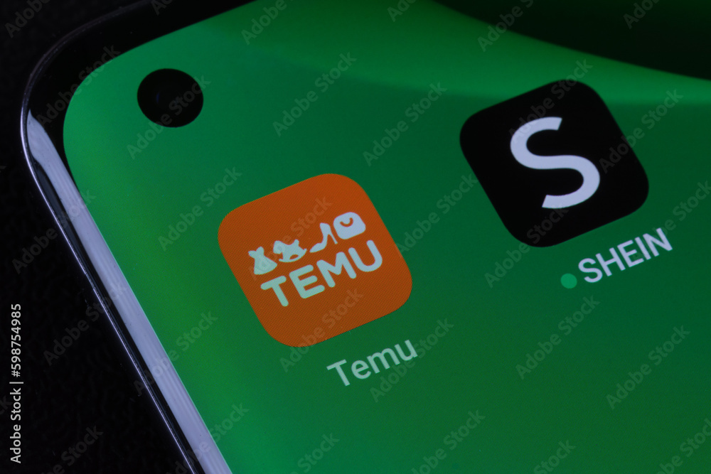 TEMU and SHEIN apps seen on the screen of smartphone. Temu app and ...