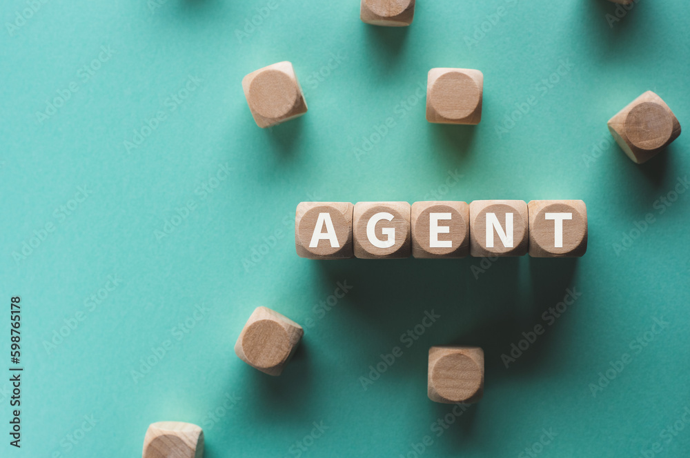 There is wood cube with the word AGENT.It is as an eye-catching image ...