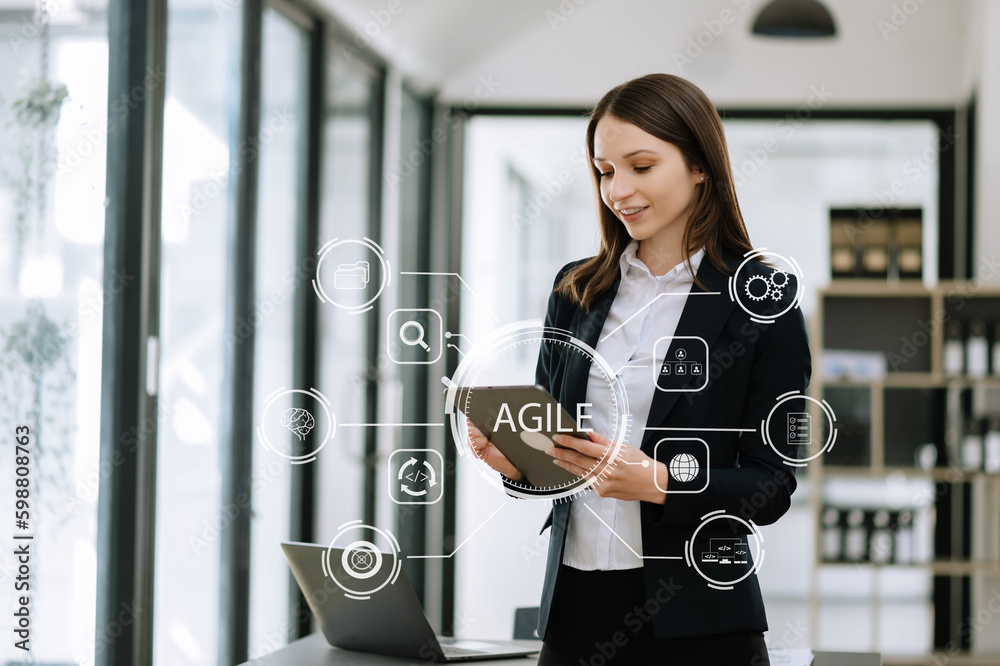 Agile development methodology concept. Business hand using laptop ...