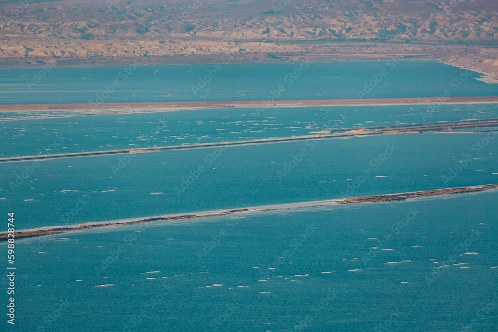 Mountains and blue sea landscape. Industrial facilities. Pontoon mining ...