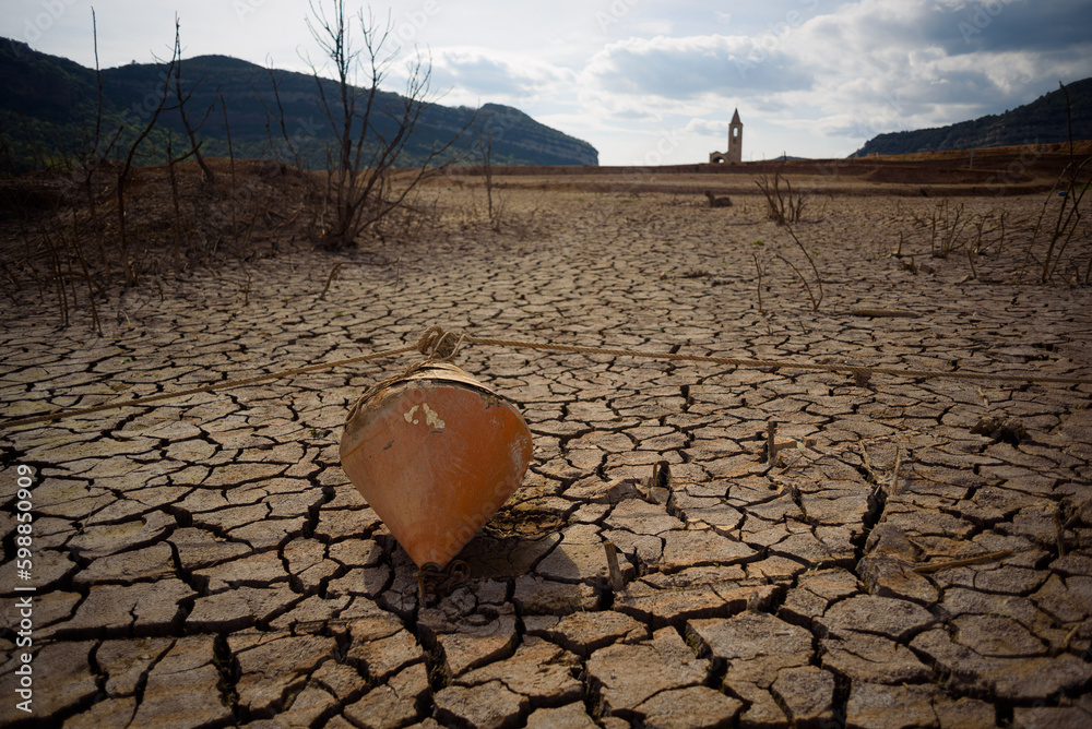 Scorched earth and earth clods are seen on dry land caused by drought ...