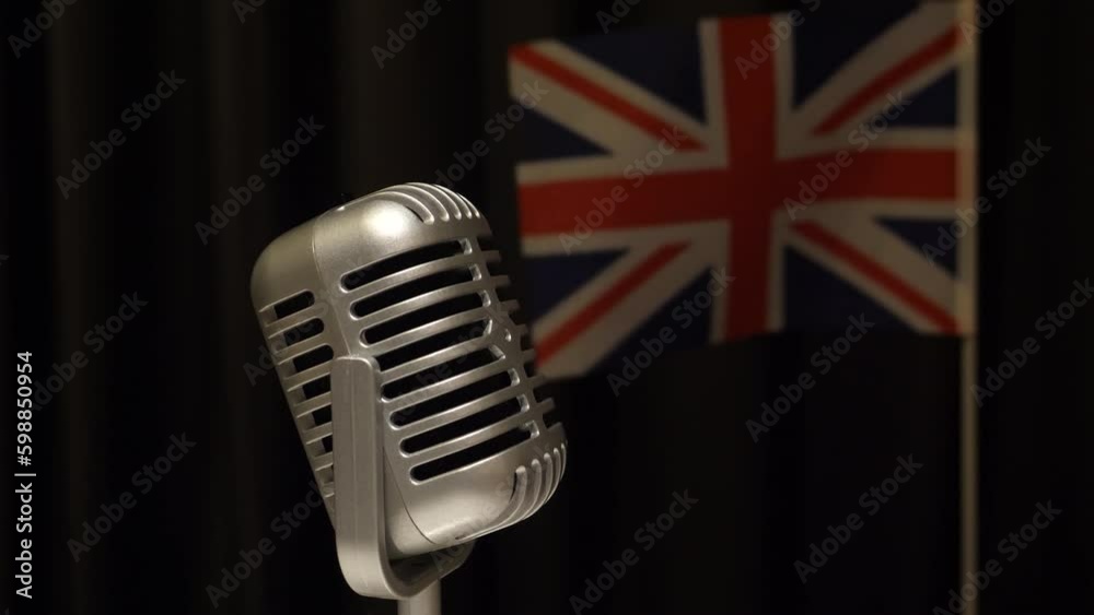 Vidéo Stock Vintage style silver colour microphone rotating slowly, GB ...