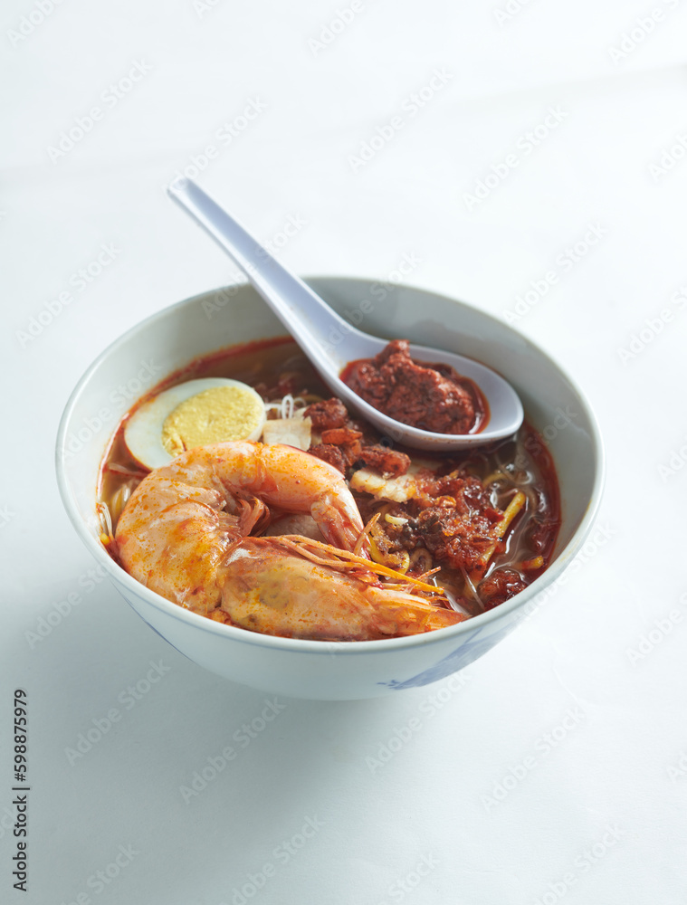 Hokkien Mee (prawn noodle soup) isolated on white background with chili ...