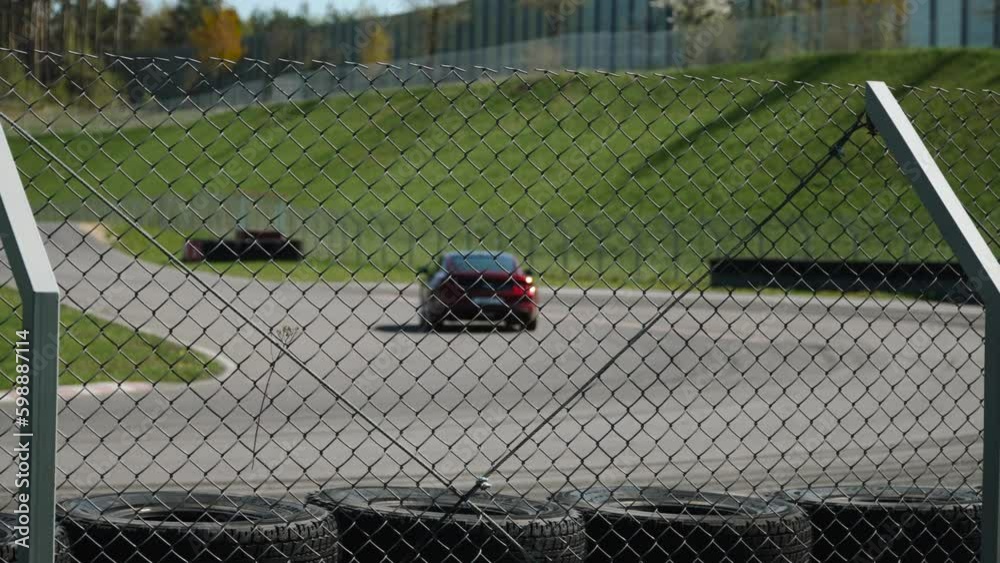 Safety fencing of racing ring track made of metal mesh and stacks of ...