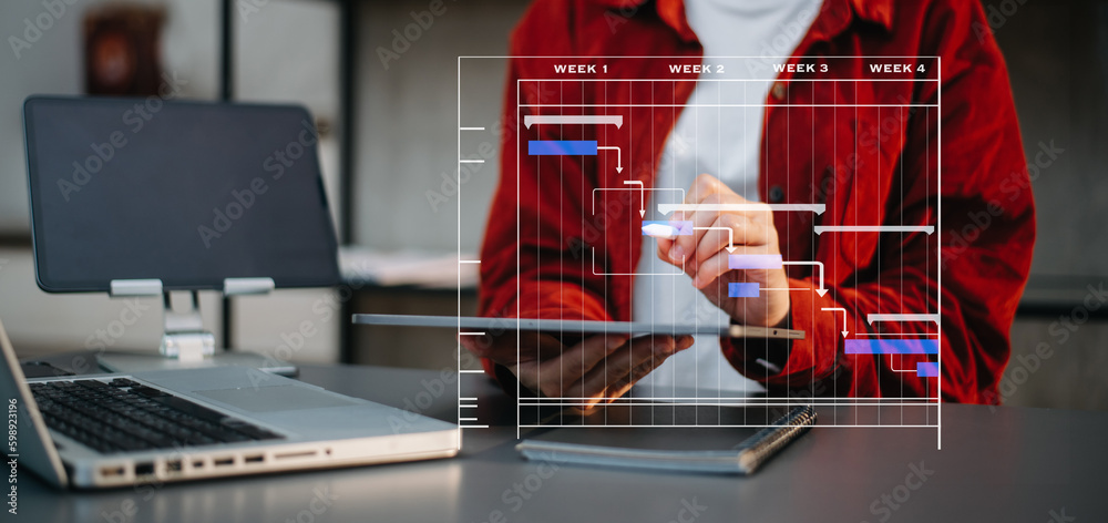 Project manager working and update tasks with milestones progress ...