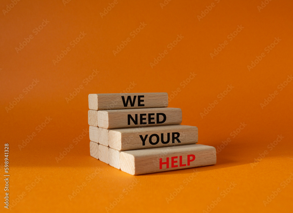 We need your help symbol. Wooden blocks with words We need your help ...