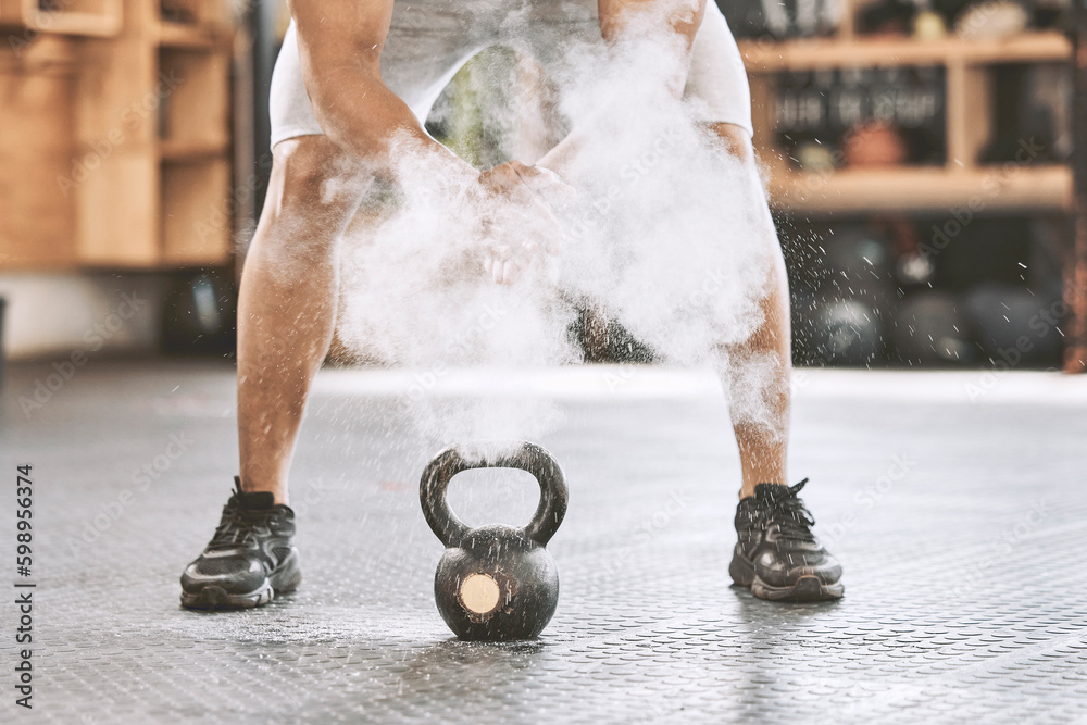 Dusting before power lifting. Bodybuilder getting ready to lift a heavy ...
