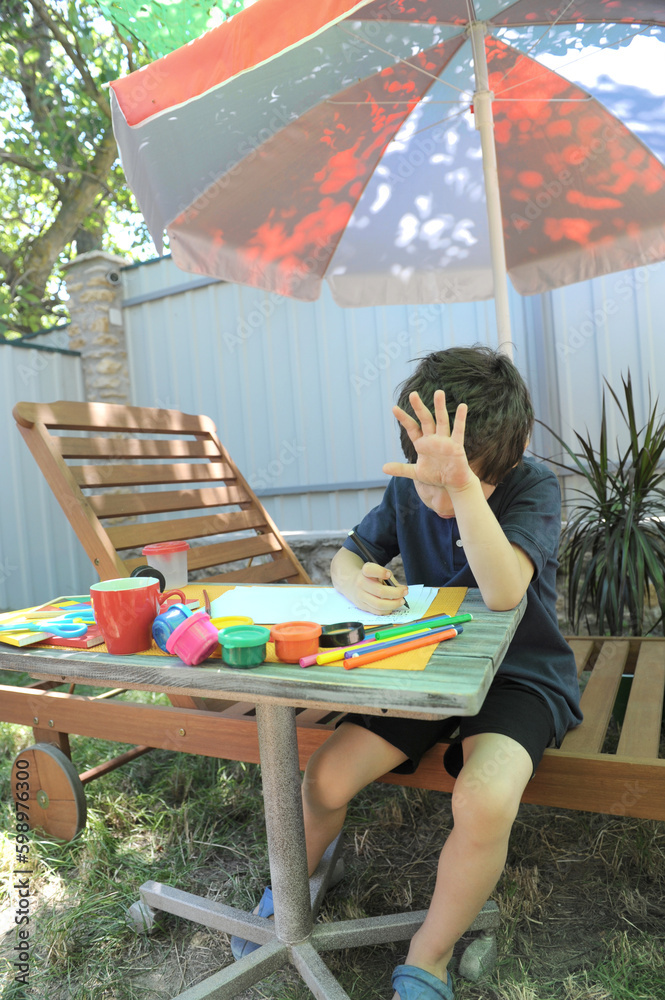 Child boy drawing at the backyard, show do not disturb Stock Photo ...