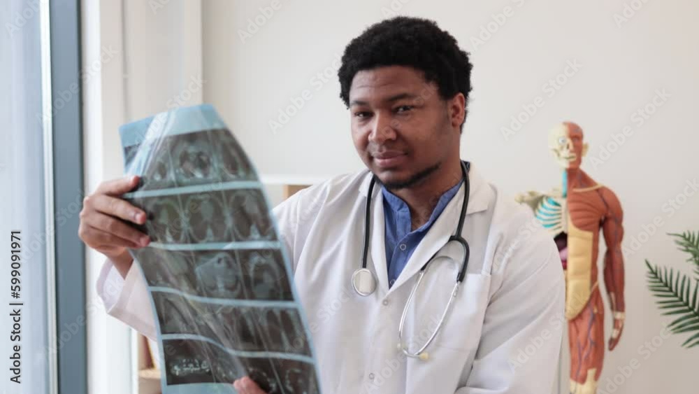 Confident african american man in doctor's coat with stethoscope ...