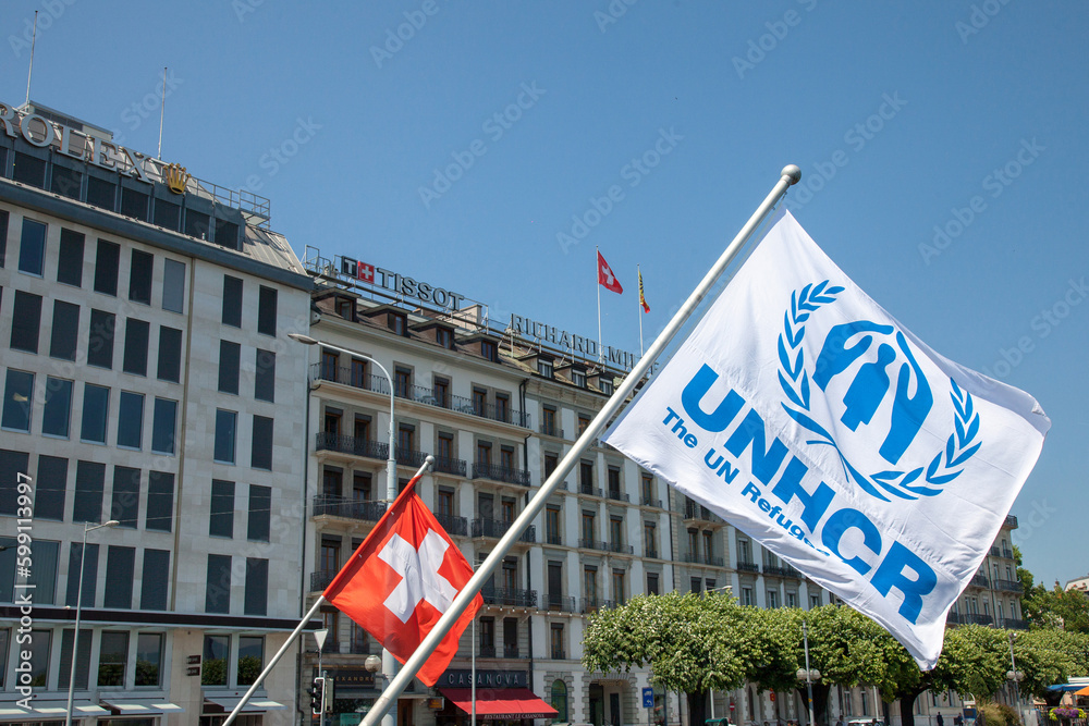 GENEVA, SWITZERLAND - JUNE 19, 2017: Swiss flag and UNHCR flags near ...