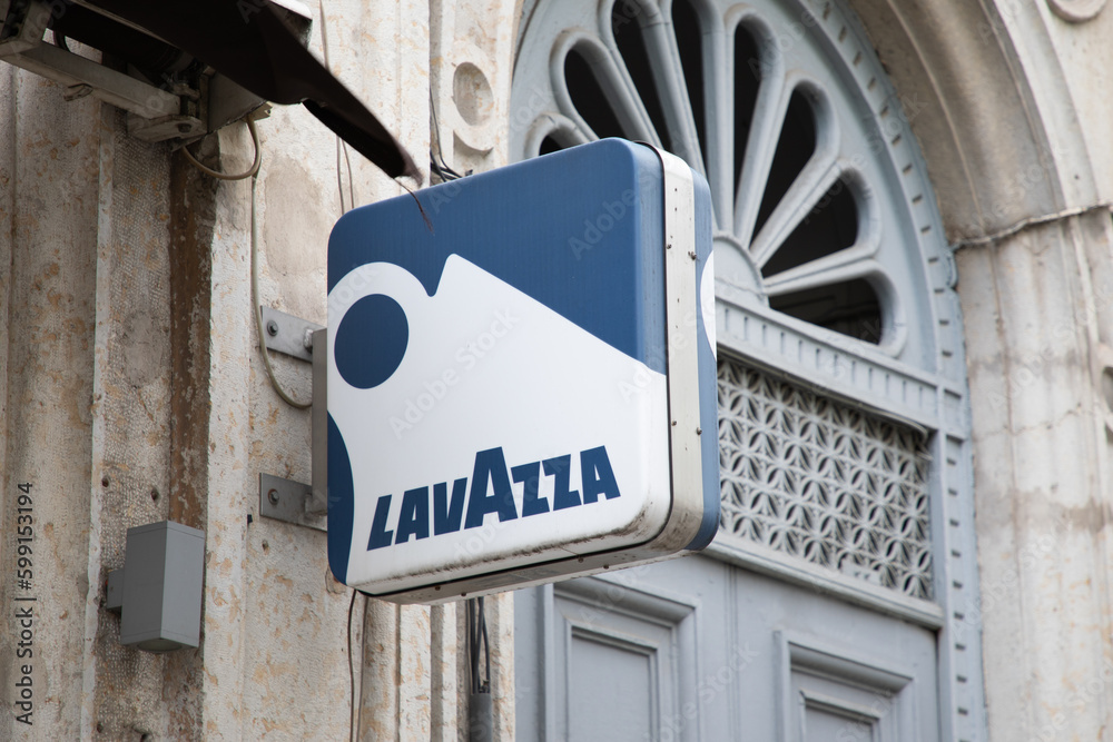 Lavazza logo brand and sign text of coffee signboard wall bar building ...