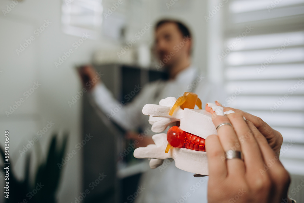 Model of human spine with inflamed intervertebral hernia on black ...