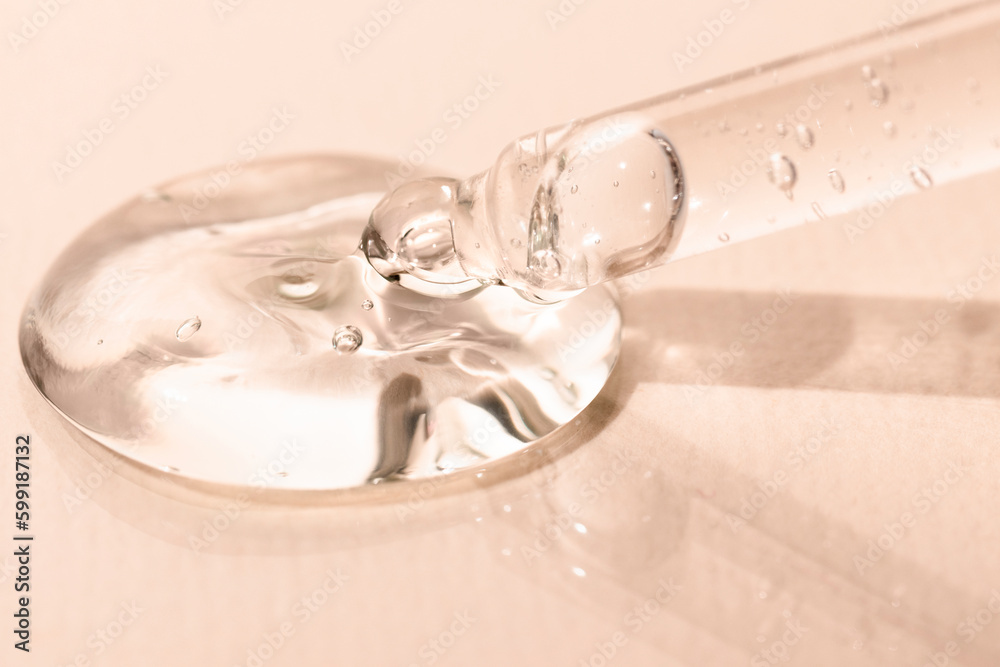 Dropper with hyaluronic acid on a beige background, front view. Aloe ...
