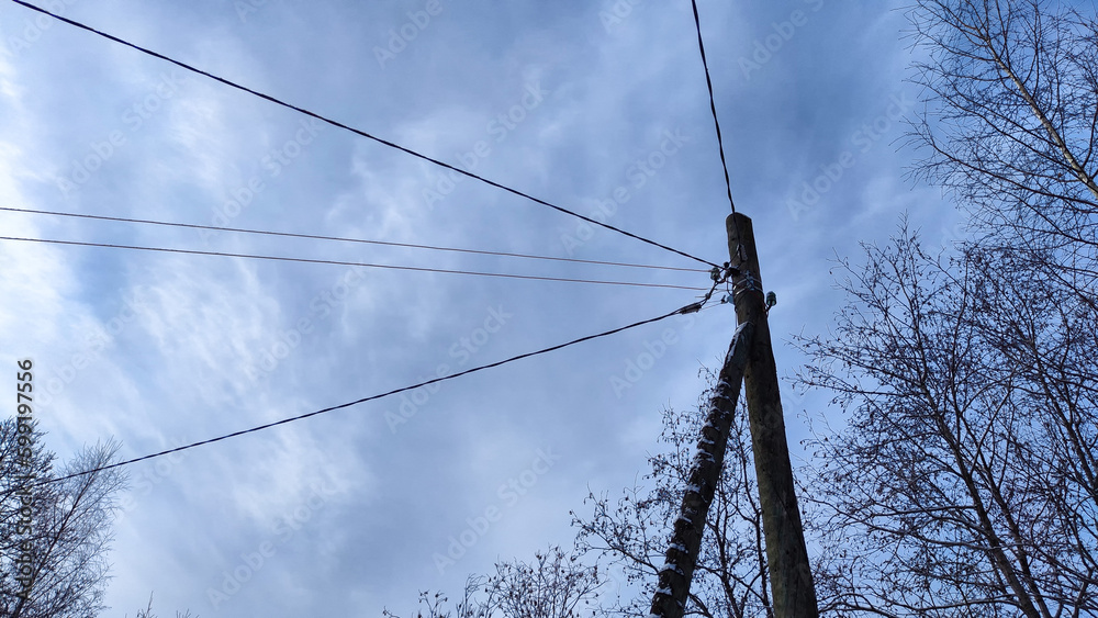 Power electric pole with line wire on blue background close up ...