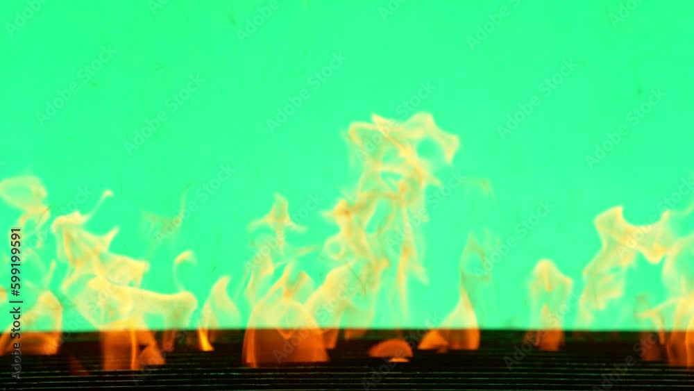 Super slow motion of fire flames with cast iron grate on green screen ...