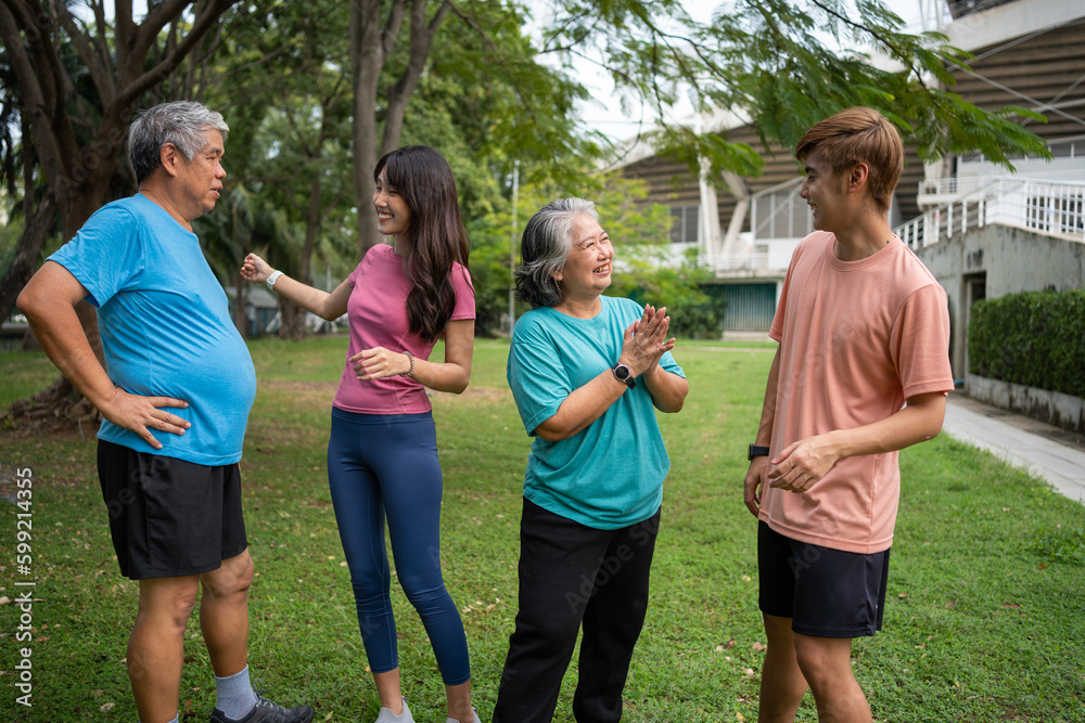 Healthy family group instructors workout in fresh air, and they rest ...