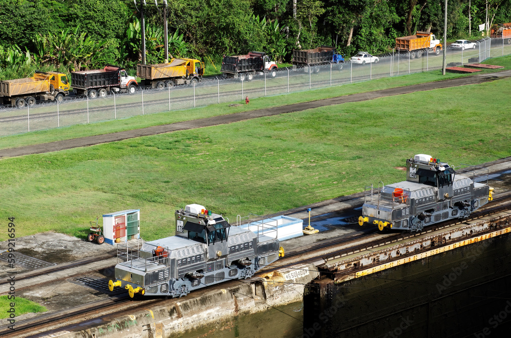 Engine operator secured to a vessel going up the lock on the Panama ...