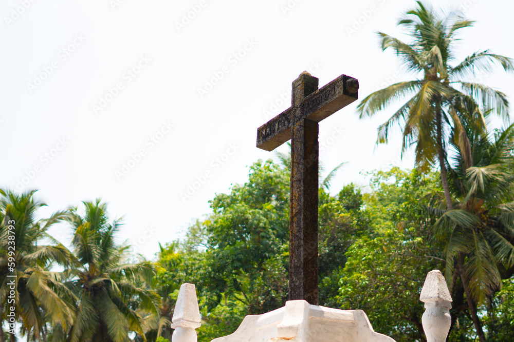 Closeup shot of Crucifix Bom Jesus in front of Palm trees at Basilica ...