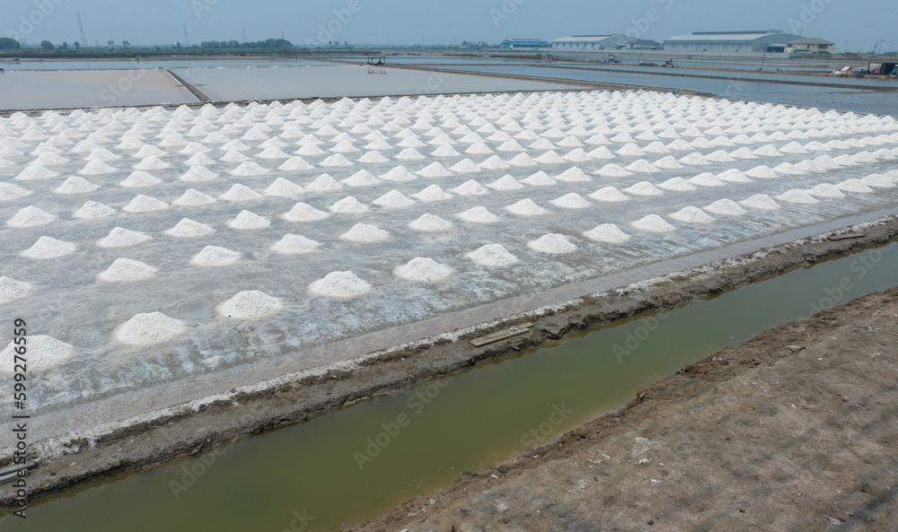 Aerial view of sea salt farm. Pile of brine salt. Raw material of salt ...