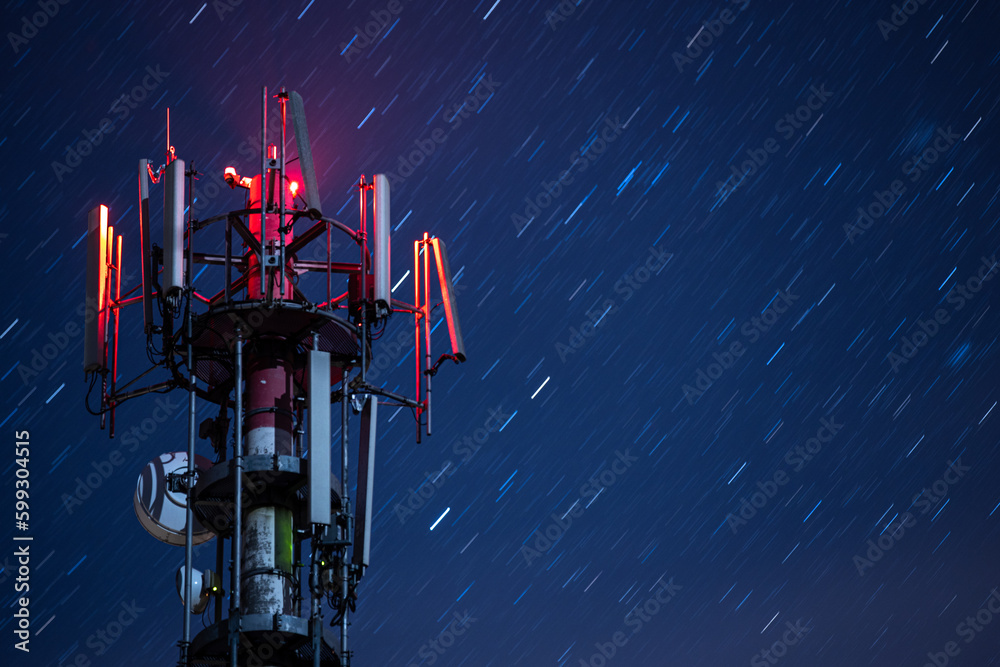 Telecommunication towers with 5G cellular network antennas on nature ...