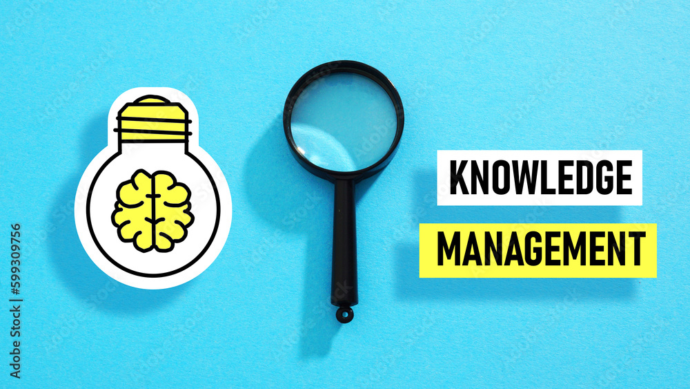 Knowledge Management is shown using the text and photo of magnifying ...