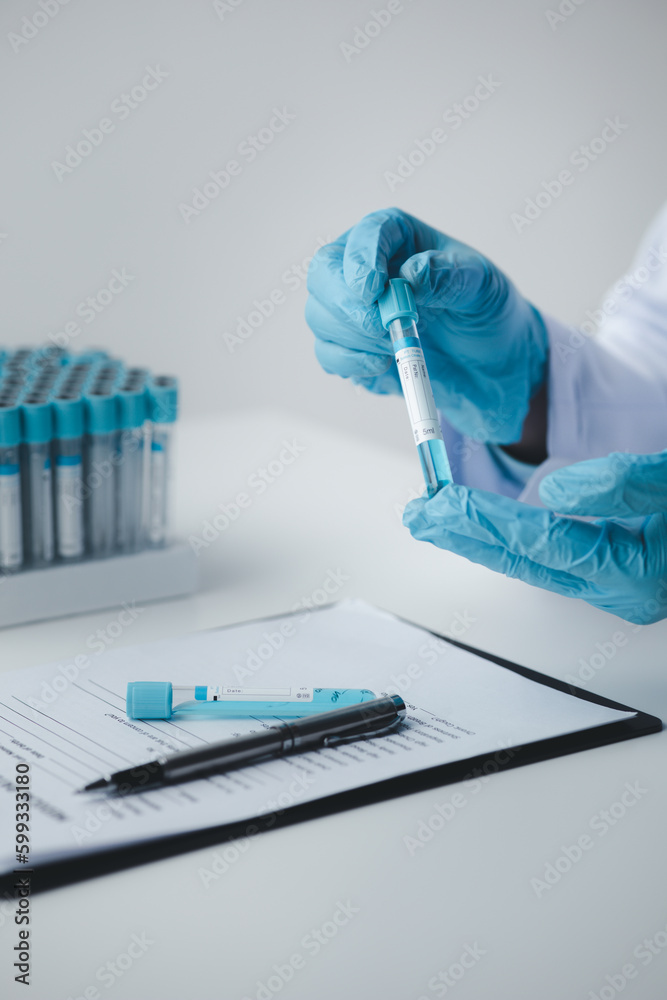 Lab assistant, a medical scientist, a chemistry researcher holds a ...