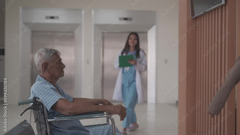 friendly atmosphere in the hospital . the smiling nurse is talking with care to the elderly male ...