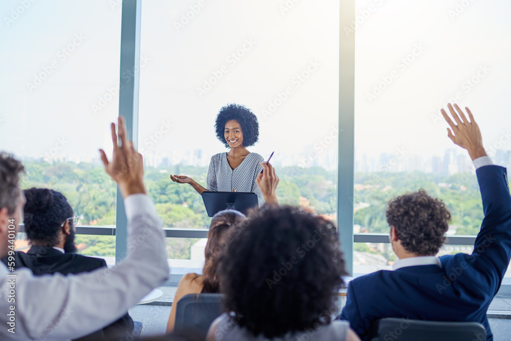 Ill take your questions now. a young businesswoman answering questions ...