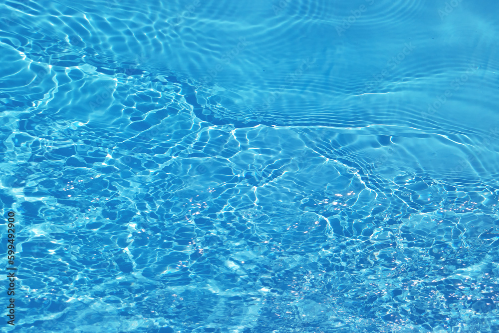 Blue water with ripples on the surface. Defocus blurred transparent ...
