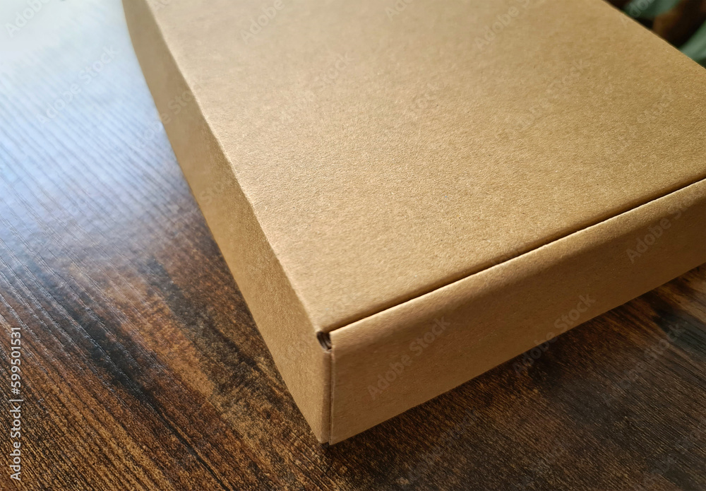 Carboard box mockup. Template of a carton packaging on wooden surface ...