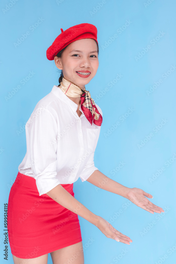 A flight attendant or stewardess guiding people to the left side ...