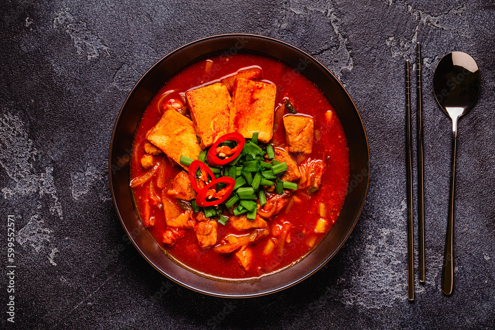 Korean traditional food, spicy kimchi soup (kimchi tige) with pork and ...