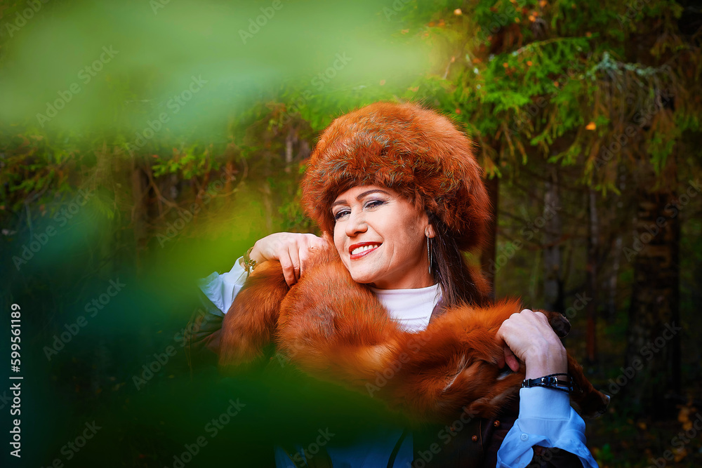 Girl in a leather jacket, a big red fox fur hat and with the skin of a ...