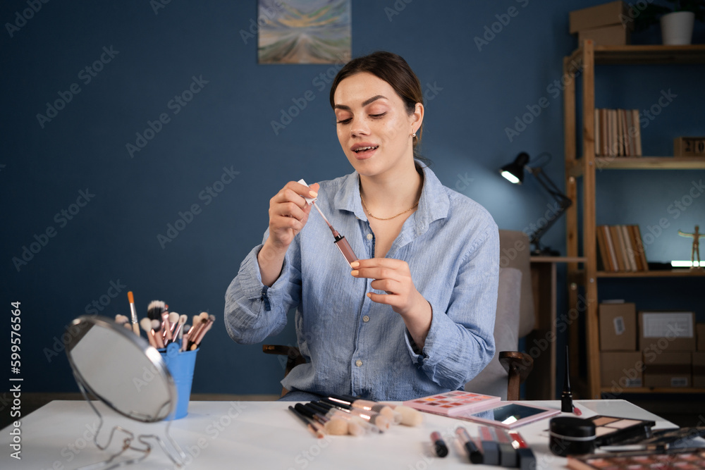 Beauty blogger woman filming daily makeup tutorial near camera on ...